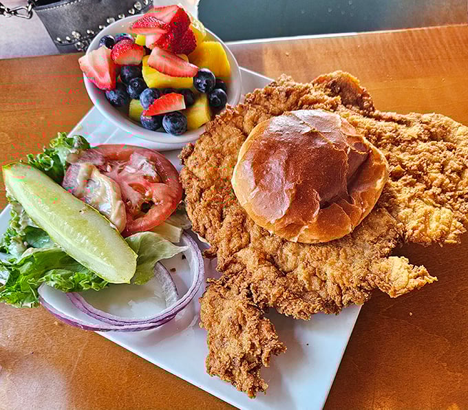 The pork tenderloin&mdash;Indiana's unofficial state sandwich&mdash;served with fresh fruit that makes you feel slightly virtuous about your indulgence.