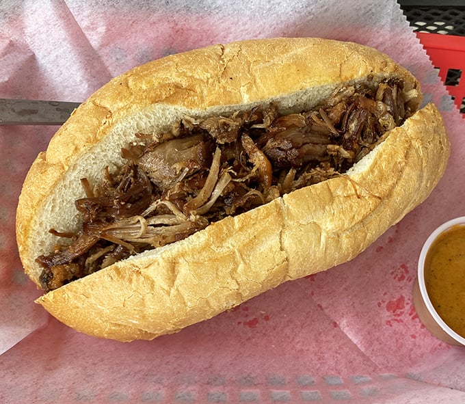 Pulled pork perfection &ndash; tender, juicy meat cradled in a fresh roll. The kind of sandwich that demands both napkins and your undivided attention.