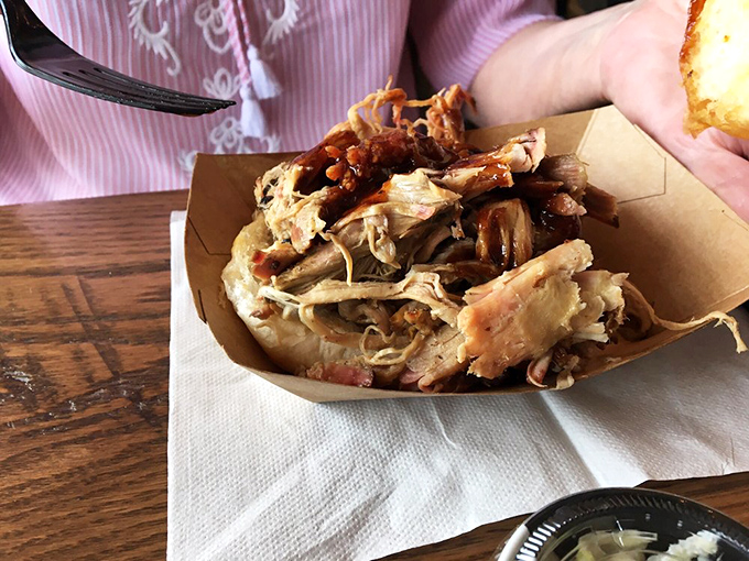 Pulled pork so tender it practically surrenders to gravity. The kind of sandwich that makes you consider moving to Warren permanently.