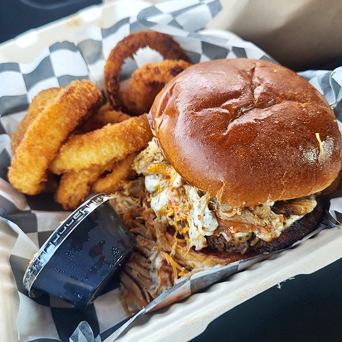 This isn't just a sandwich &ndash; it's an engineering marvel of pulled pork, slaw, and a bun that somehow contains the delicious chaos.