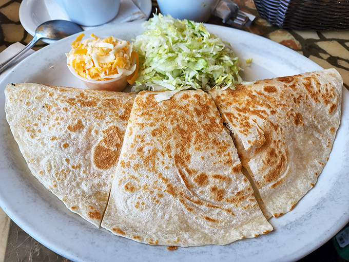 A quesadilla so perfectly golden and crisp, it deserves its own spotlight and backup dancers. Simple perfection that speaks the universal language of cheese.