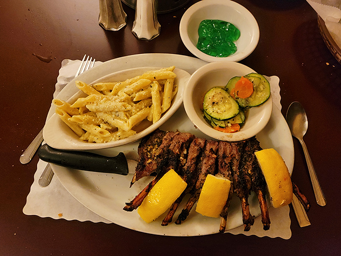 Rack of lamb that makes you question every other rack you've ever met. Those seasoned fries look like they could start their own fan club.