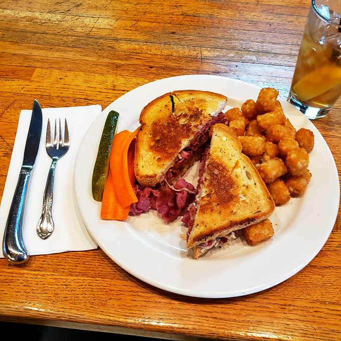 The ultimate test of any diner: a proper Reuben. Crispy grilled bread, tangy sauerkraut, and tater tots that remind you why simplicity always wins.