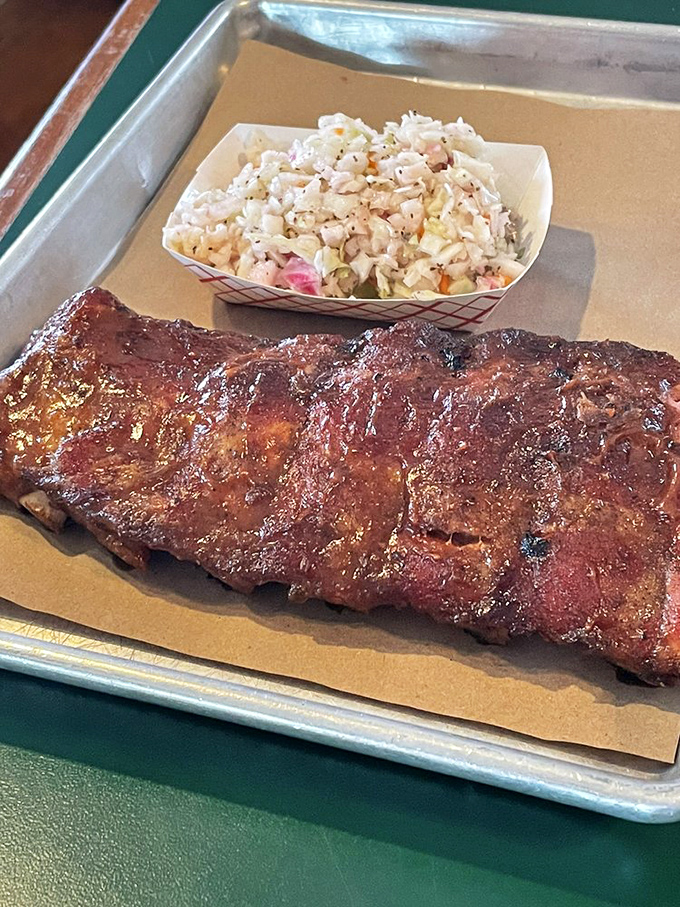 Ribs with the perfect bark alongside creamy coleslaw – a relationship more harmonious than most Hollywood marriages.