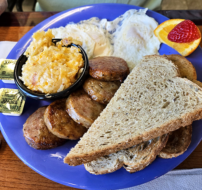 Breakfast fundamentals executed with respect. Those sausages look like they graduated from meat university with honors, alongside eggs that know their purpose.