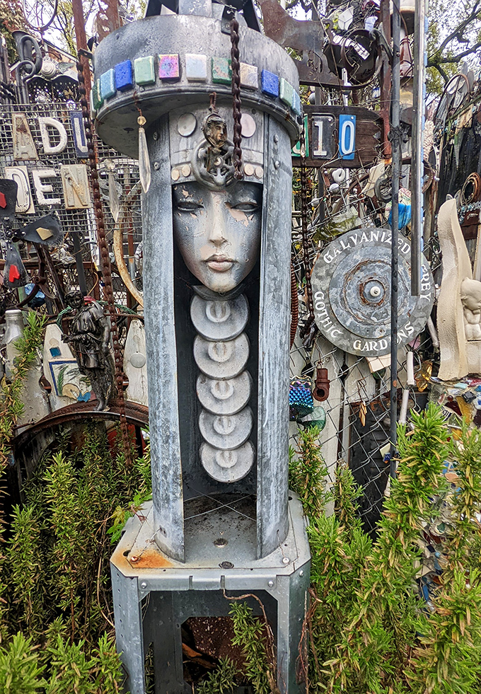 Regal and haunting, this metal maiden stands sentinel among the chaos. Her serene expression asks, "What exactly are you staring at?"