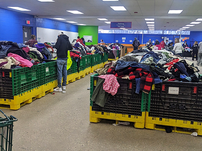 The thrill of the hunt in action&mdash;shoppers navigate the clothing bins like seasoned explorers, each with their own treasure map.