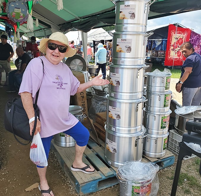"I've been coming here for decades!" Metal cookware towers become conversation starters as shoppers bond over bargain hunting victories.