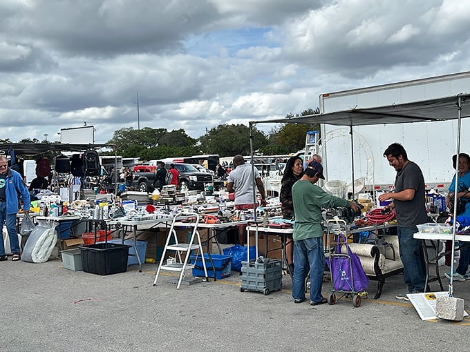 The art of the deal in action. Shoppers and vendors engage in the time-honored dance of negotiation that makes flea markets the last bastion of true retail interaction.