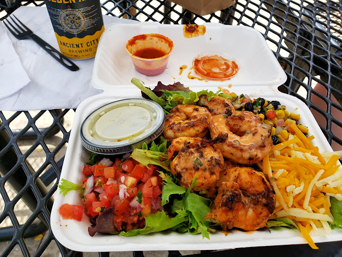 Grilled shrimp perched atop a colorful salad like tiny flavor bombs waiting to detonate on your taste buds.