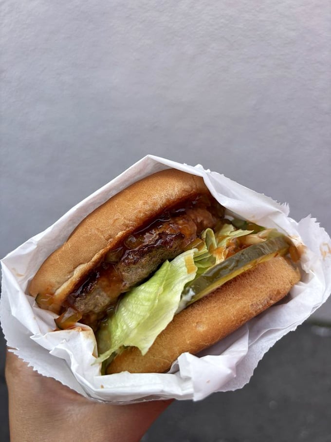 Paper-wrapped perfection that makes modern "gourmet" burgers seem like overpriced pretenders. This is what fast food aspired to be before corporations got involved.