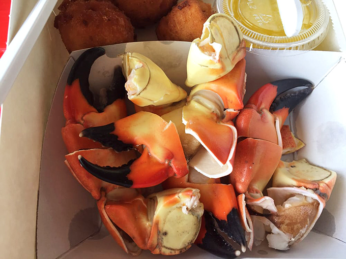 Sweet, tender stone crab claws with hush puppies and butter&mdash;dockside seafood doesn&rsquo;t get fresher or tastier than this classic combo!