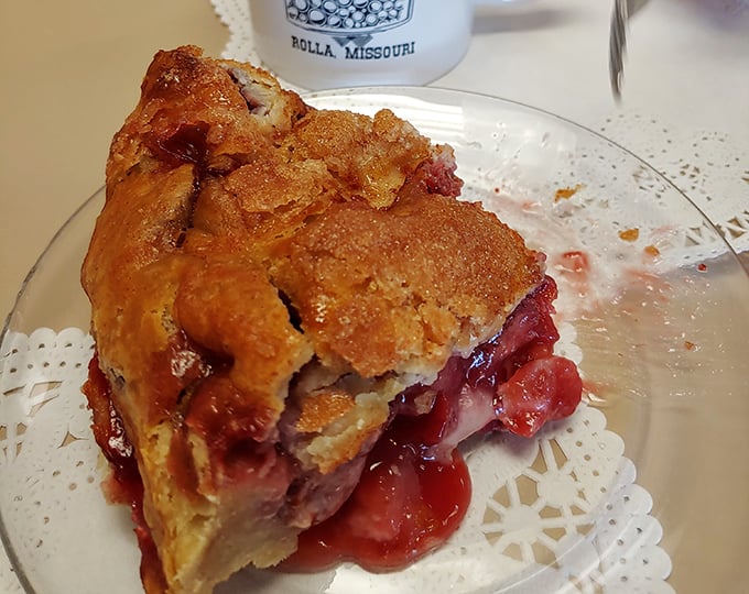 This cherry pie isn't messing around. The crimped crust creates a golden fortress around a ruby filling that balances sweet and tart like a culinary tightrope walker.
