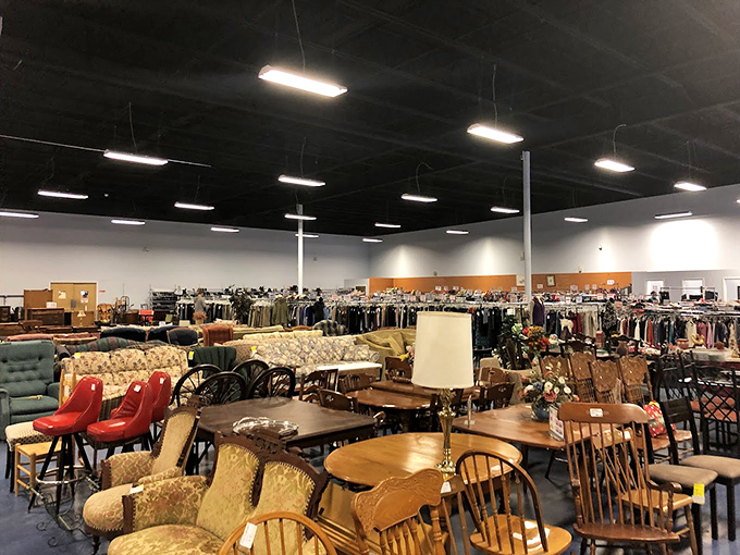 Mid-century meets country charm in this furniture tableau. That pair of bright red chairs is practically screaming, "Take me home to your living room!"