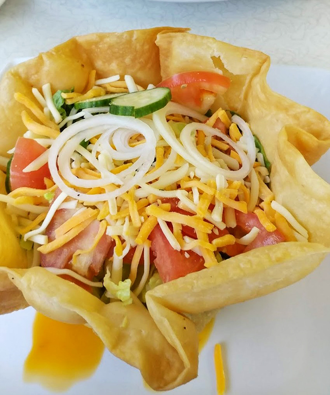 Taco salad served in a crispy shell bowl &ndash; because sometimes your food should come in an edible container. Genius!