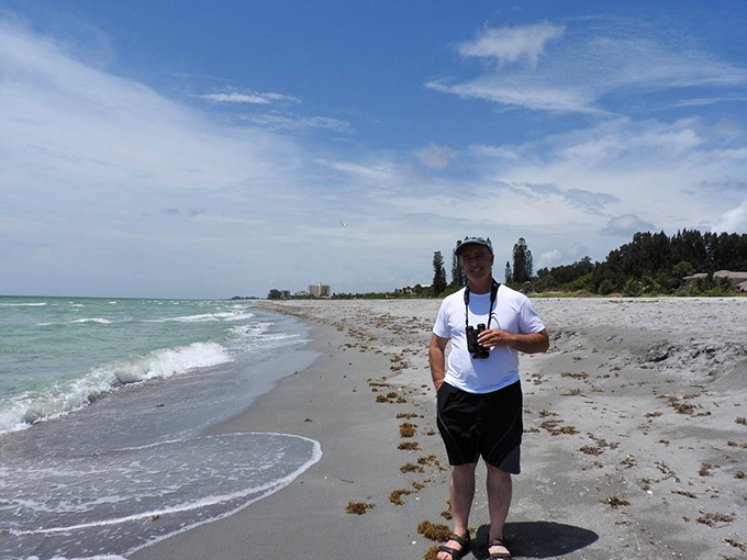 Beach explorers come in all styles. This shoreline stroller demonstrates the proper Caladesi stance: relaxed, camera-ready, and blissfully unplugged from office emails.
