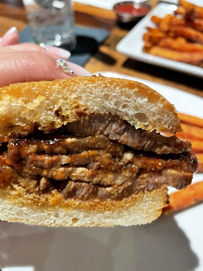 The tri-tip sandwich isn't just a meal, it's a masterclass in meat-to-bread ratio that would make any Californian proud.