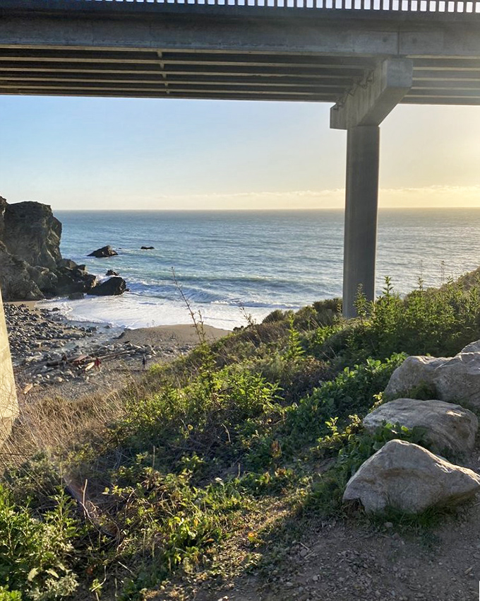 The Highway 1 bridge frames a perfect view of Limekiln Beach. This spot proves that sometimes the journey and destination can be equally spectacular.
