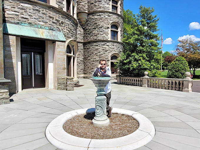 The castle's stone entrance pavilion offers the perfect spot for contemplation—or pretending you're royalty surveying your domain. Either works beautifully.