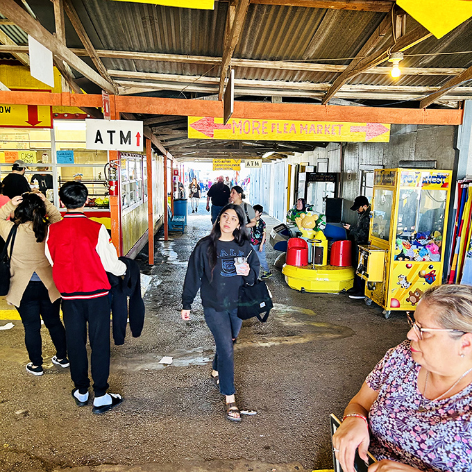 The "MORE FLEA MARKET" sign isn't just a direction&mdash;it's an invitation to adventure that shoppers follow with the enthusiasm of kids chasing an ice cream truck.