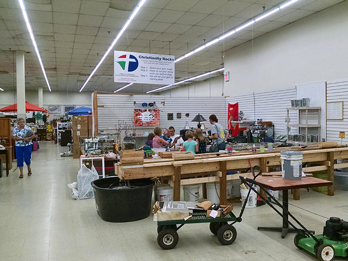 Under the "Christianity Rocks" banner, shoppers gather around tables of potential treasures&mdash;the community aspect of flea marketing at its finest.