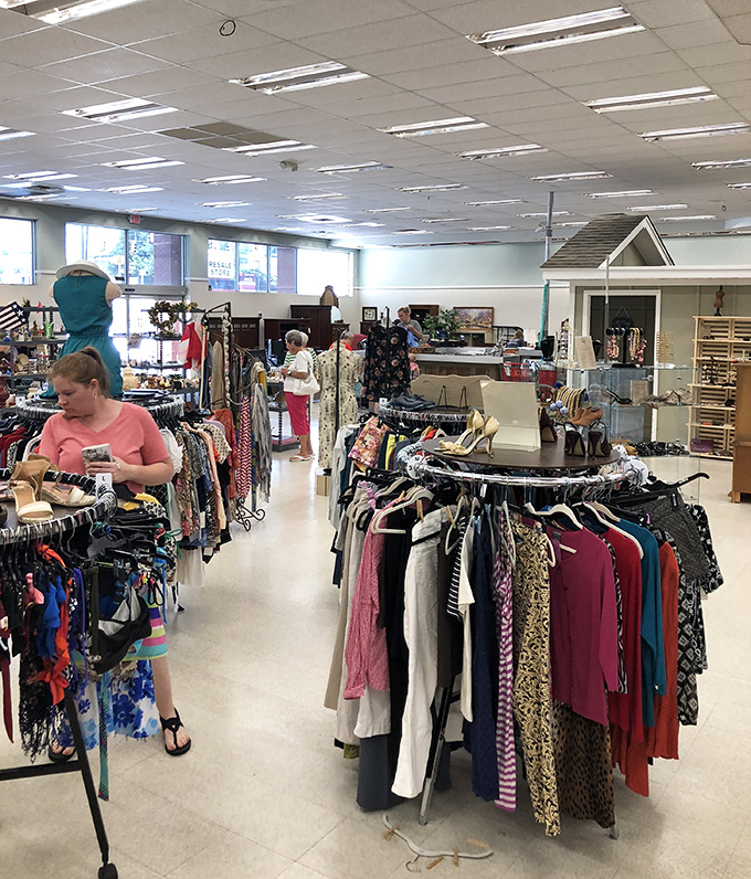 Treasure hunters navigate the clothing section with the focused determination of archaeologists on the verge of a major discovery.