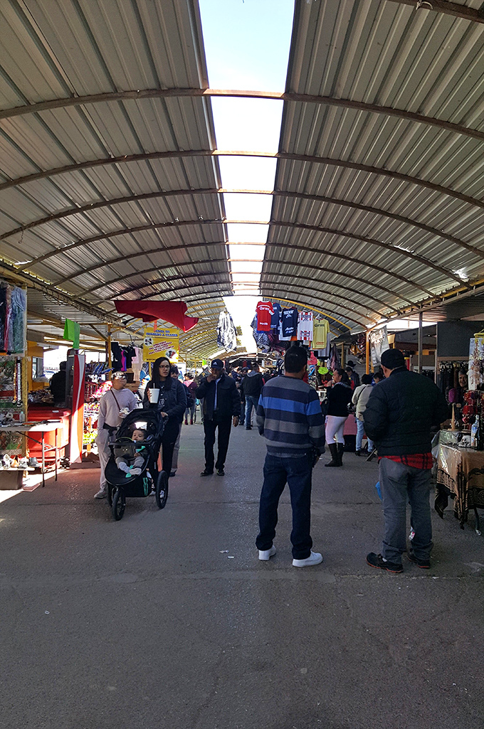 The weekend crowd moves with purpose through the covered walkways. Family shopping here isn't an errand&mdash;it's a multi-generational tradition passed down like secret recipes.