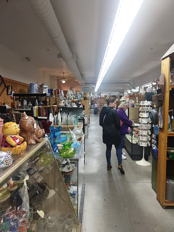 Shoppers navigate the labyrinth of memories, each display case offering a different decade's worth of collectibles and conversation starters.
