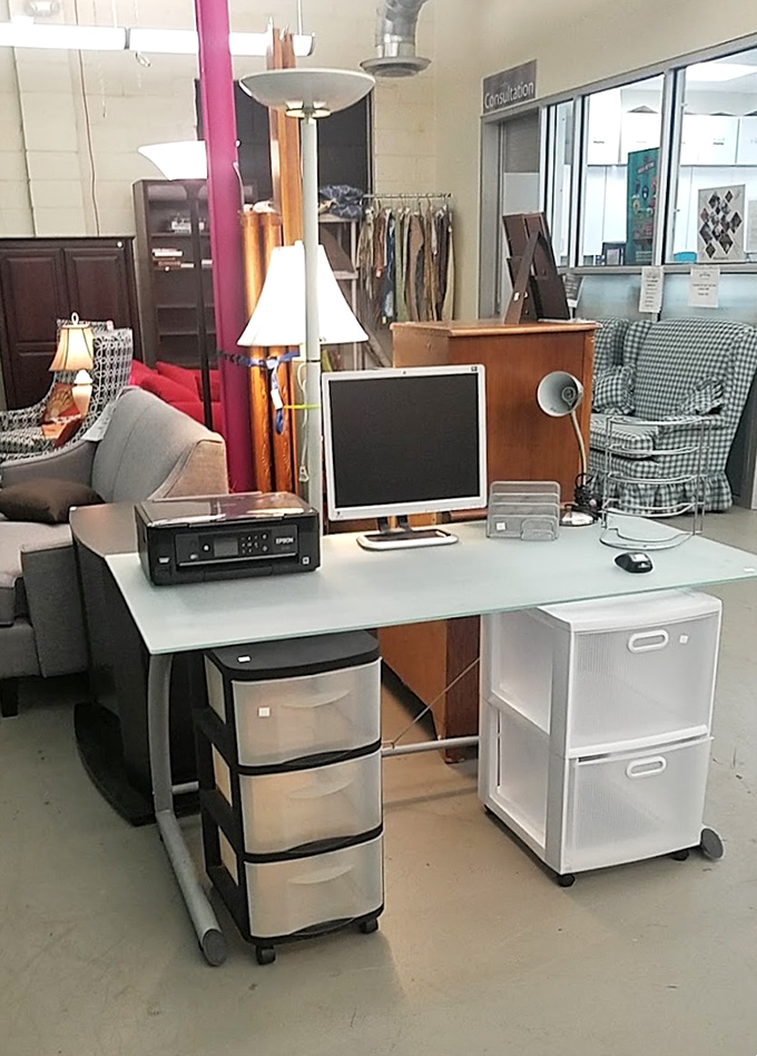 A complete home office setup awaits its next creative genius. That monitor has probably witnessed someone's screenplay draft or perhaps just hours of cat videos.