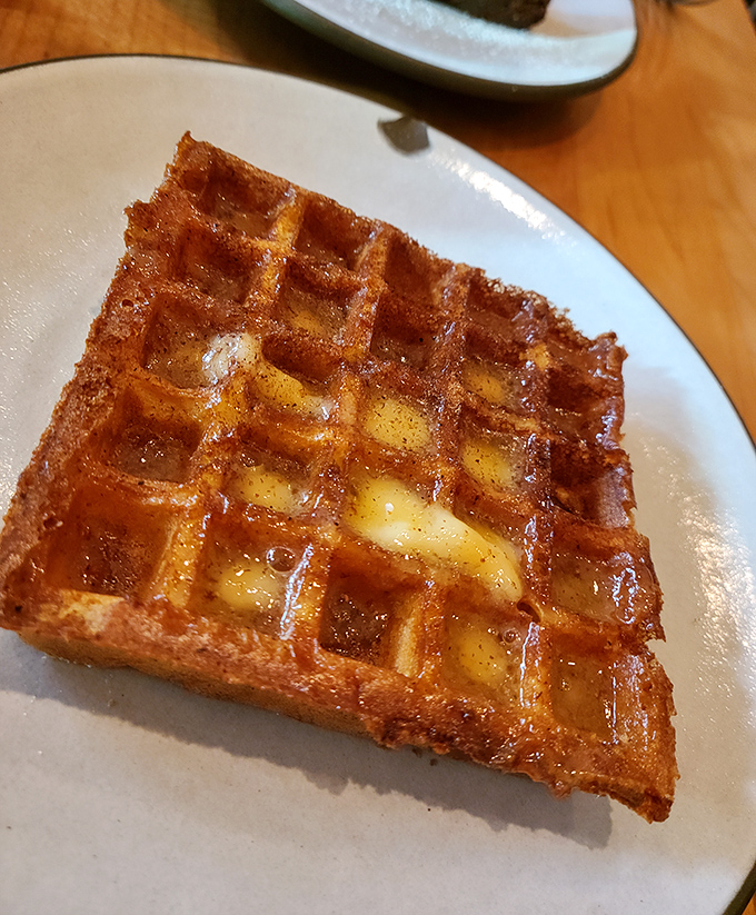 This isn't just a waffle, it's architecture with butter. Golden, crisp exterior hiding pockets of warm, custardy interior&mdash;breakfast elevated to art form.