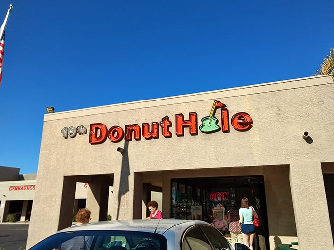 19th Donut Hole's cheerful sign with that golf-inspired logo makes perfect sense - these donuts are definitely above par!