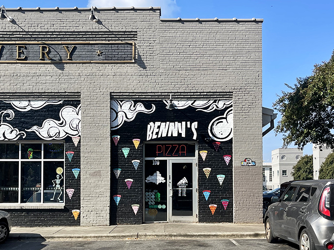 Street art meets street food! Those colorful pizza slices painted on the wall are just a preview of the creative pies inside.