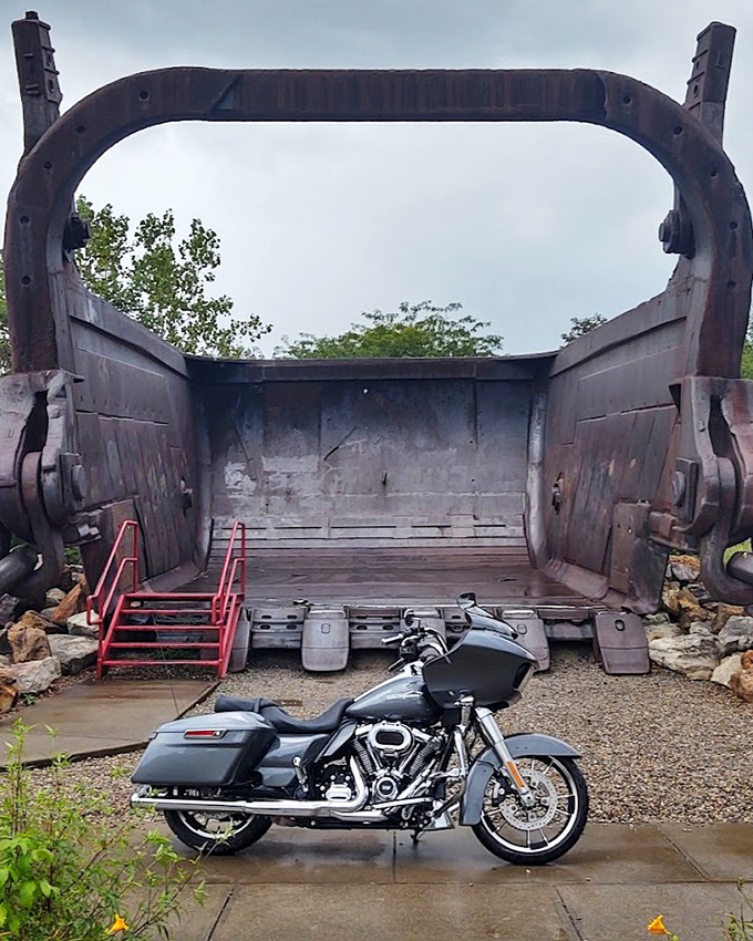 Step inside this colossal mining bucket and feel the raw power of industrial history surrounding you completely.