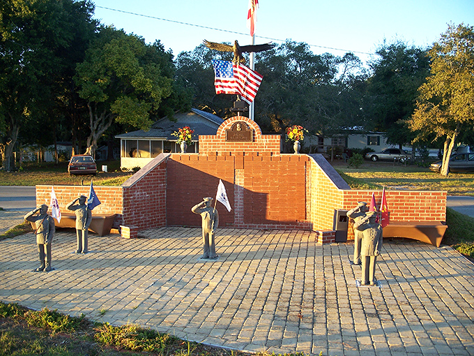 That veterans memorial stands proud as morning coffee, honoring heroes in a town that knows what matters most.