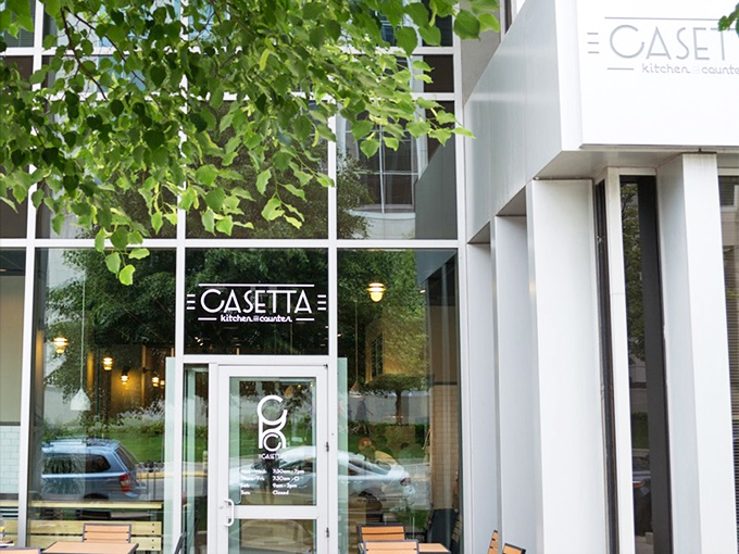 Behind that sleek glass facade lies sandwich artistry that would make Renaissance masters weep with joy.