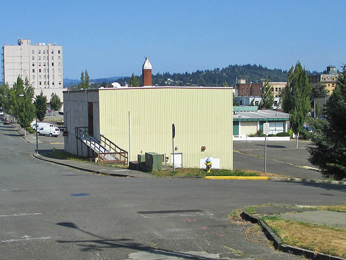 An honest shed of a building—no fuss, no frills, just standing strong under the sun.