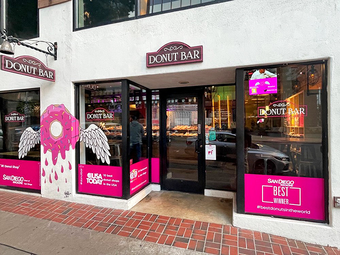 Donut Bar's pink-accented storefront brings a touch of whimsy to downtown San Diego. Even the winged donut looks ready to fly into your mouth.