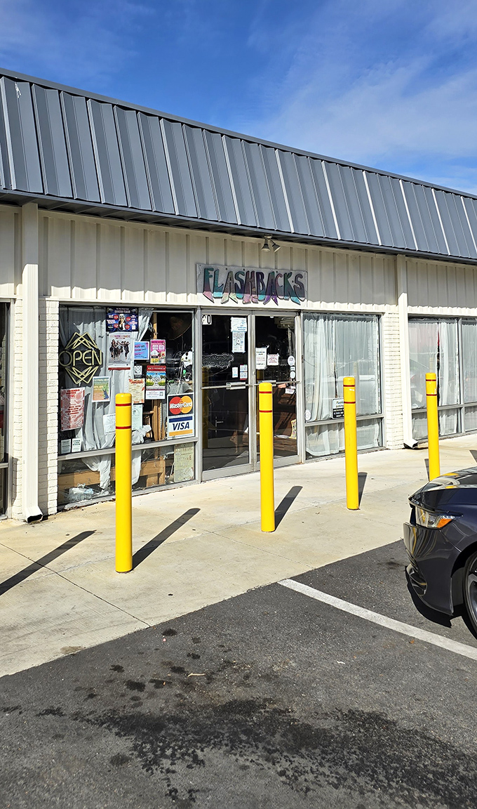 Flashbacks' unassuming storefront hides a time machine of fashion treasures. Yellow safety poles guard the entrance to decades past.