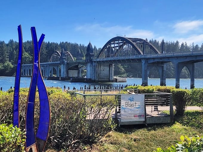 Where the Siuslaw River flows under timeless arches. Art, bridges, and coastal charm in perfect harmony.