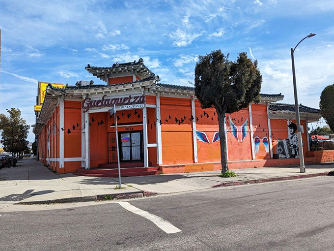 Guelaguetza's vibrant orange building stands out like a delicious beacon of Oaxacan cuisine in Los Angeles.