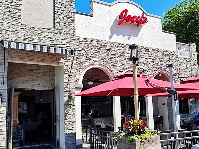 Joey's Pizza: Stone facade, red umbrellas, and pizza that makes you want to send a thank-you note to Italy.