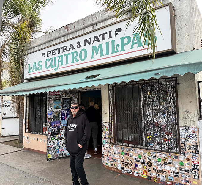Las Cuatro Milpas' sticker-covered entrance is like a passport to the most authentic Mexican food north of the border.