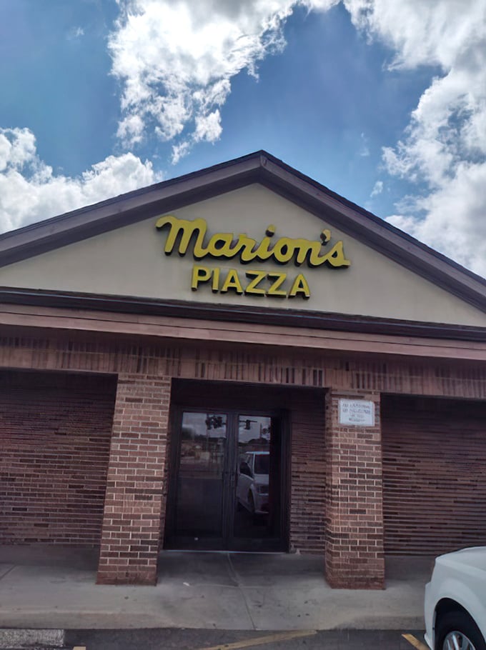 Marion's bright yellow sign beckons pizza lovers like a lighthouse. This Dayton institution knows thin-crust perfection is worth celebrating.