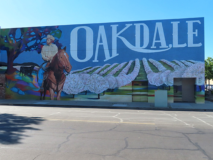 Oakdale announces itself with a vibrant mural celebrating its cowboy heritage and agricultural roots.