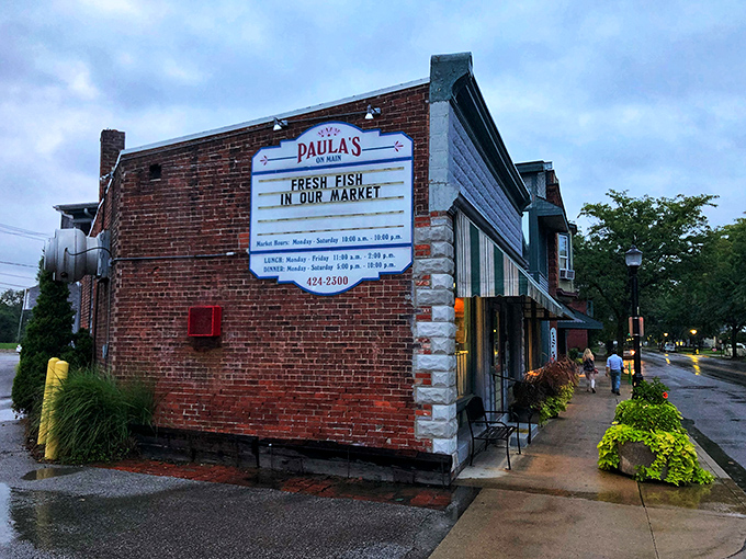 Paula's brick facade holds seafood secrets worth discovering. That vintage sign promises authenticity you can taste in every bite.