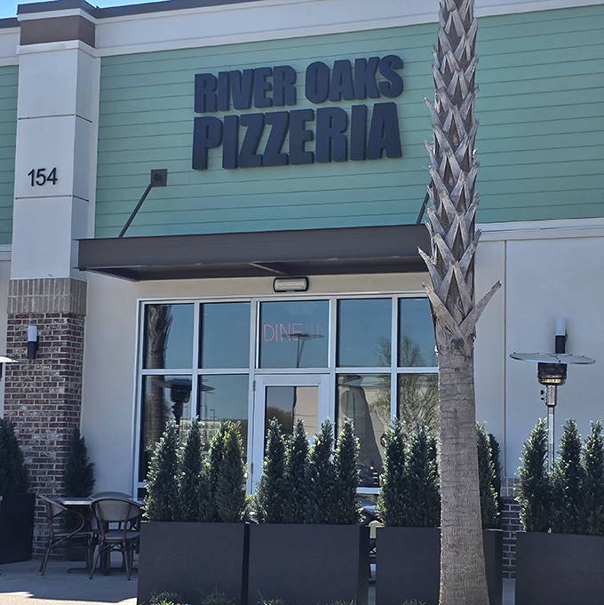 River Oaks Pizzeria's coastal-colored exterior fits perfectly in Myrtle Beach. Palm trees and pizza &ndash; a vacation for your taste buds.