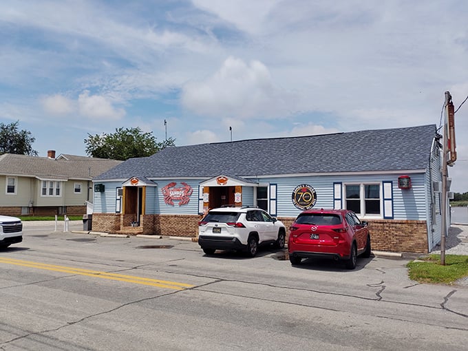 Sambo's Tavern's bright blue exterior with crab decorations is like a beacon for seafood lovers in Leipsic.