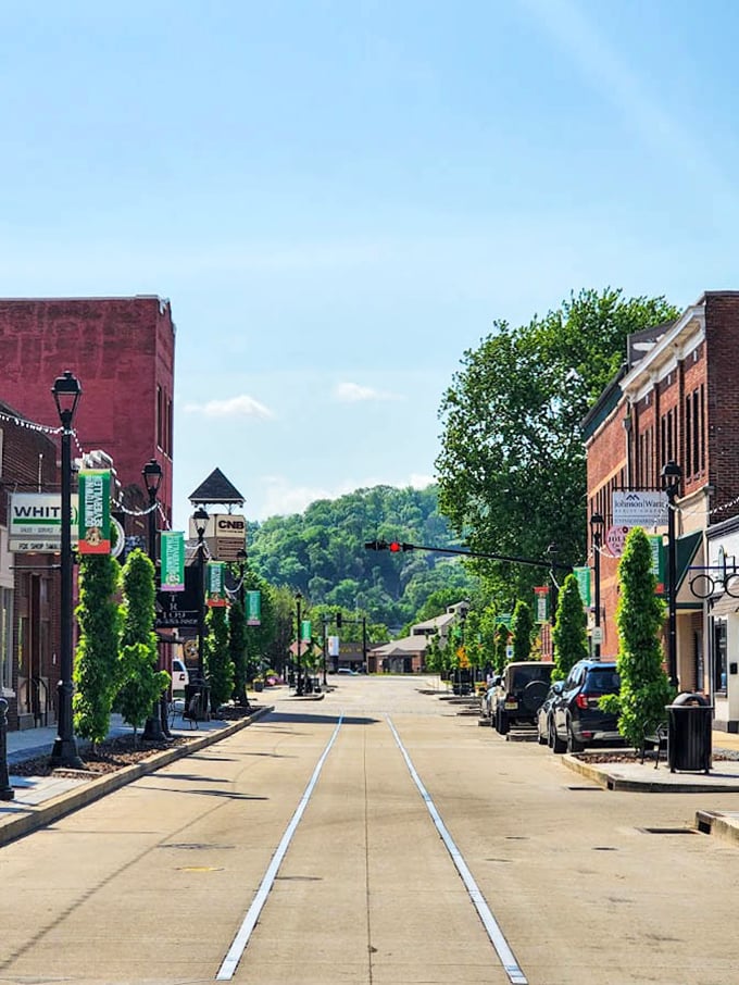 Rolling green hills stretch toward distant peaks like nature's own golf course designed by the gods.
