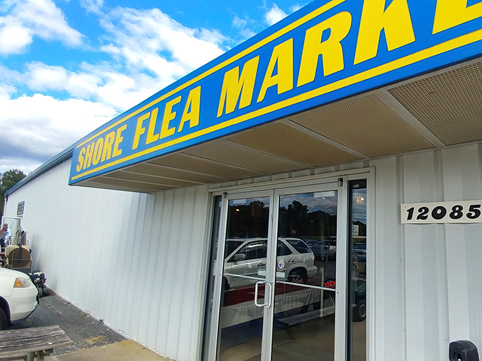 That bold blue Shore Flea Market sign is like a lighthouse for bargain hunters navigating the Eastern Shore.