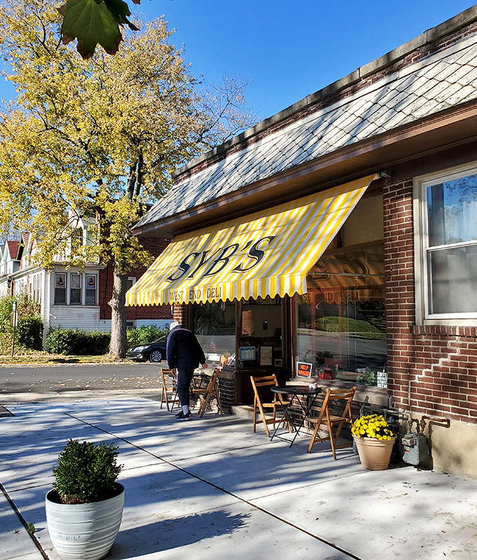 Syb's cheerful yellow awning brightens the neighborhood like the first bite of their perfect sandwich brightens your day.